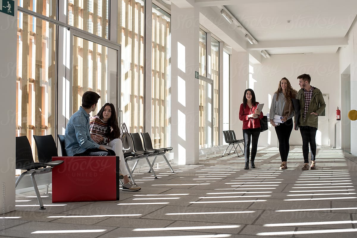 "Three Talking Students" by Stocksy Contributor "Bisual Studio" - Stocksy