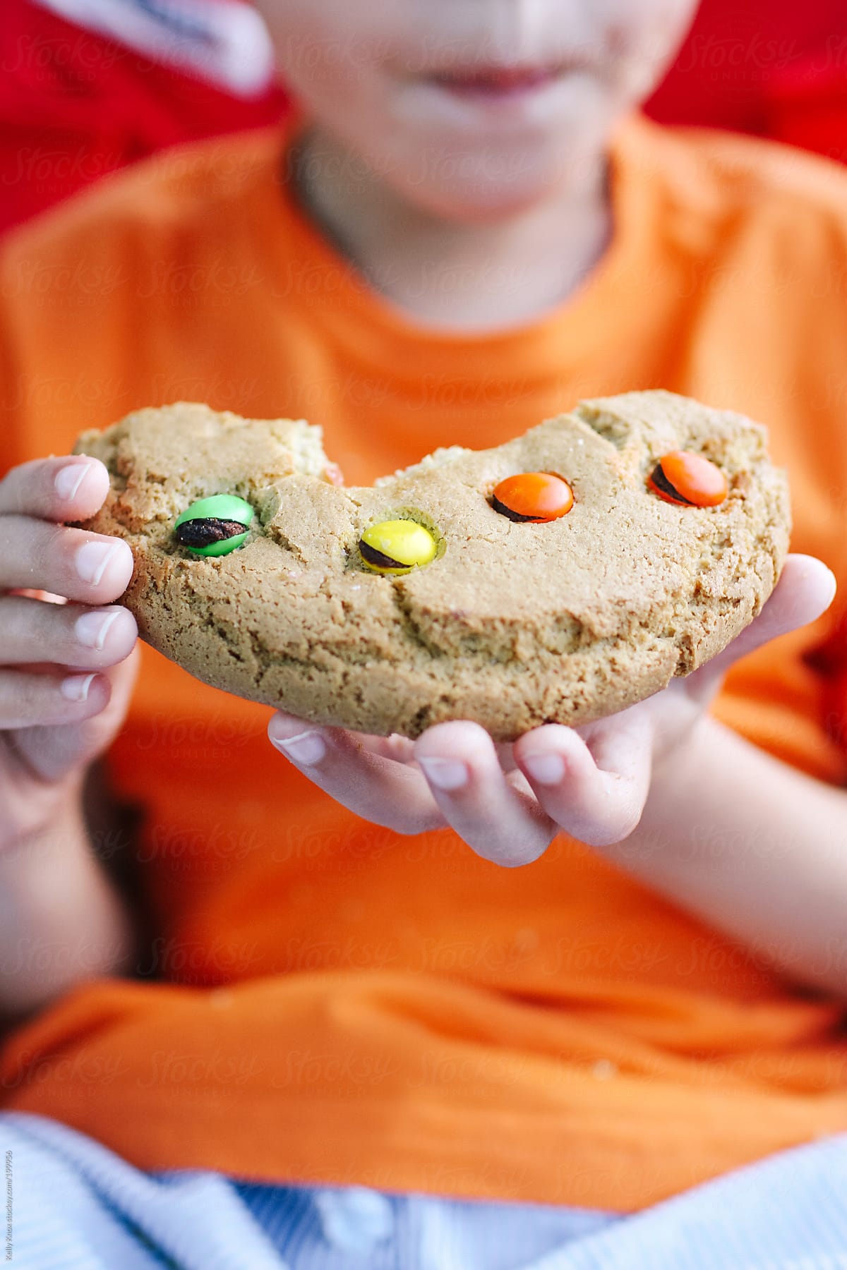 "Child Eating A Cookie" by Stocksy Contributor "Kelly Knox" - Stocksy