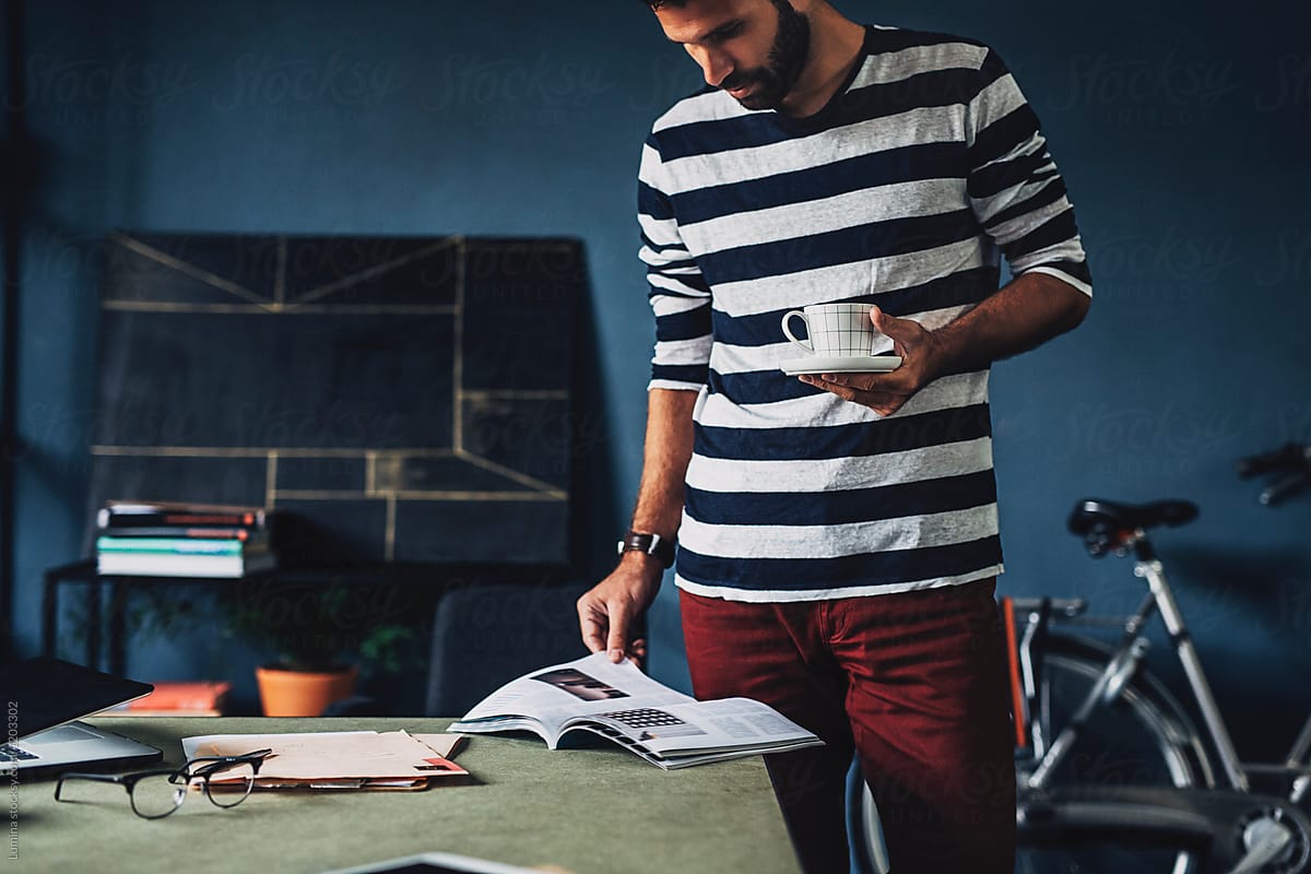 "Man Drinking Coffee And Reading Magazine" by Stocksy Contributor ...
