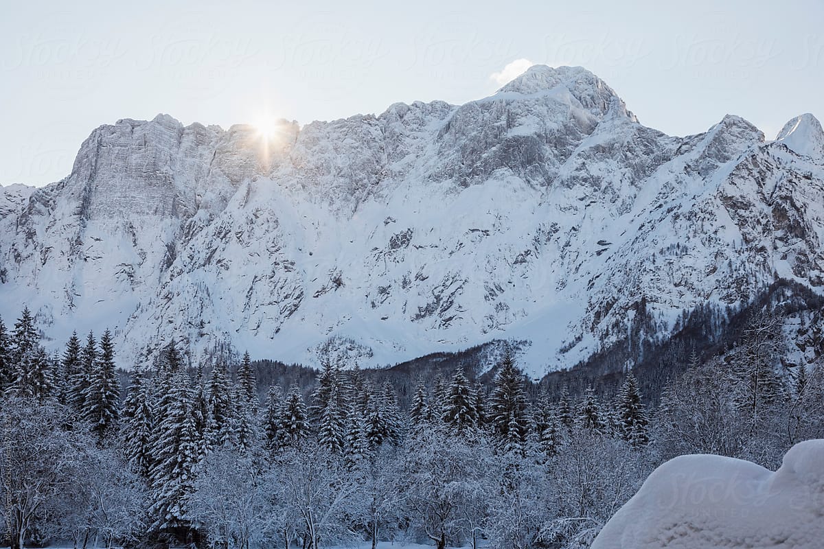 "Sun Over Snowy Mountains" by Stocksy Contributor "Mauro Grigollo ...