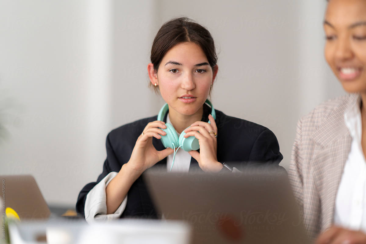 "Happy Diverse Women Communicating In Office" by Stocksy Contributor ...