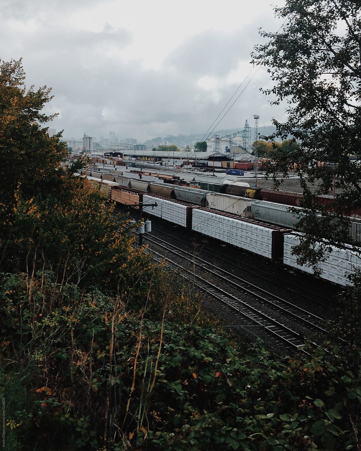 "Cloudy Train Yard" by Stocksy Contributor "Kevin Gilgan" - Stocksy