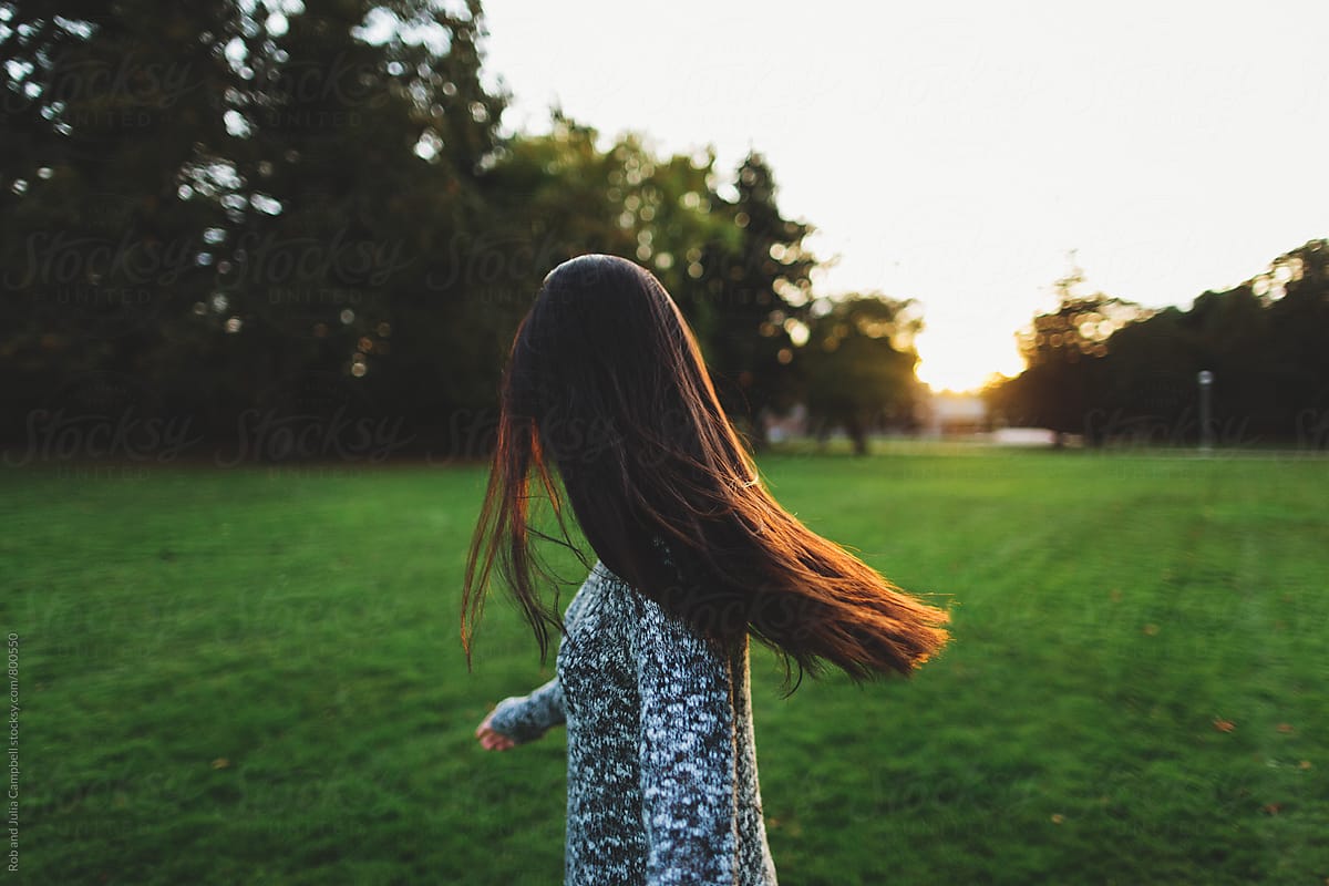 "Spinning Woman Outside On Field At Sunset" by Stocksy Contributor "Rob ...