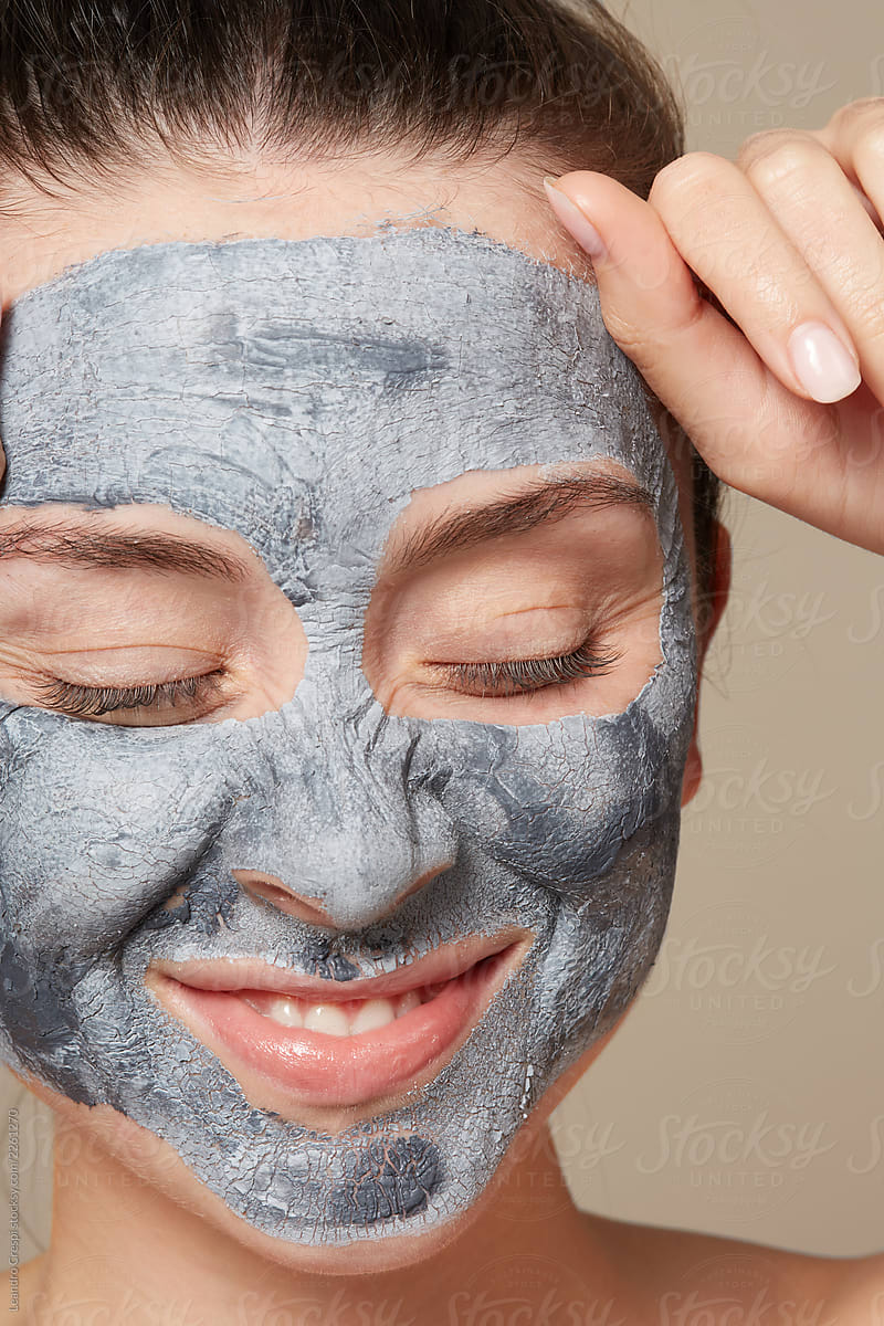 "Woman Enjoying Clay Mask" by Stocksy Contributor "Leandro Crespi ...