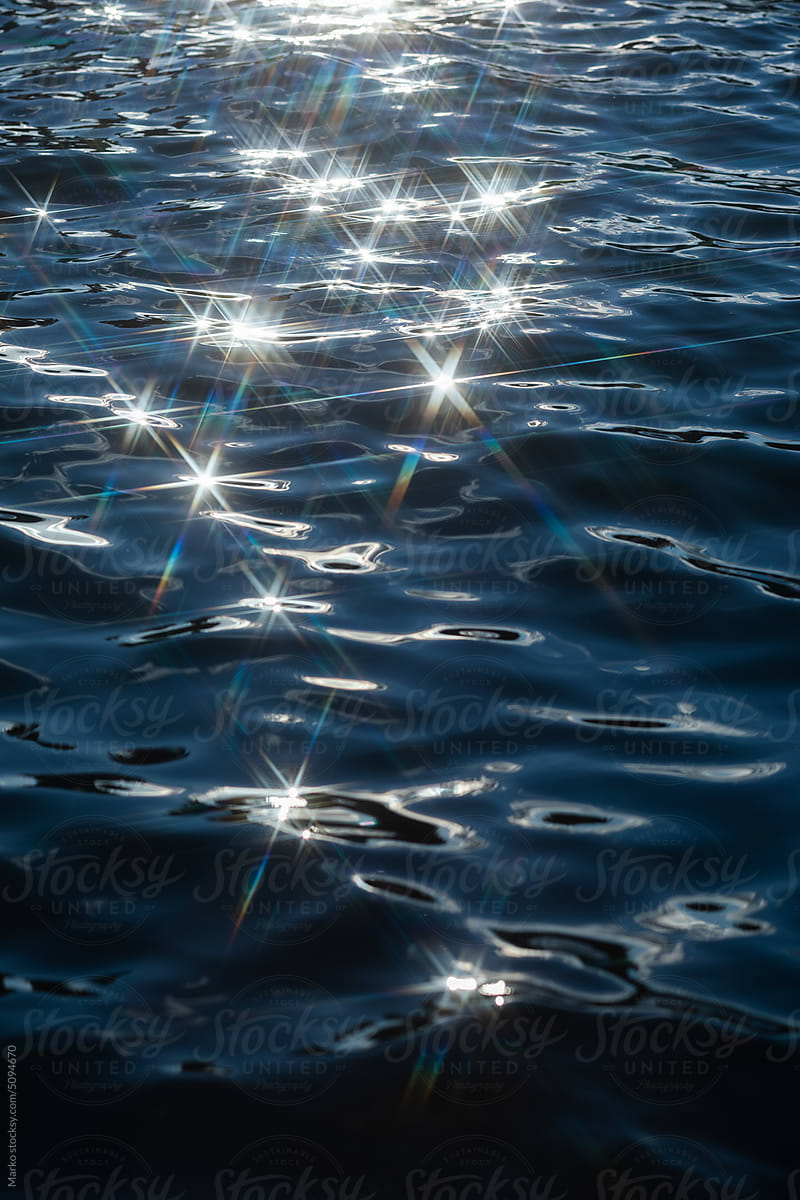 "Sun Reflection On Water Stars" by Stocksy Contributor "Marko" - Stocksy