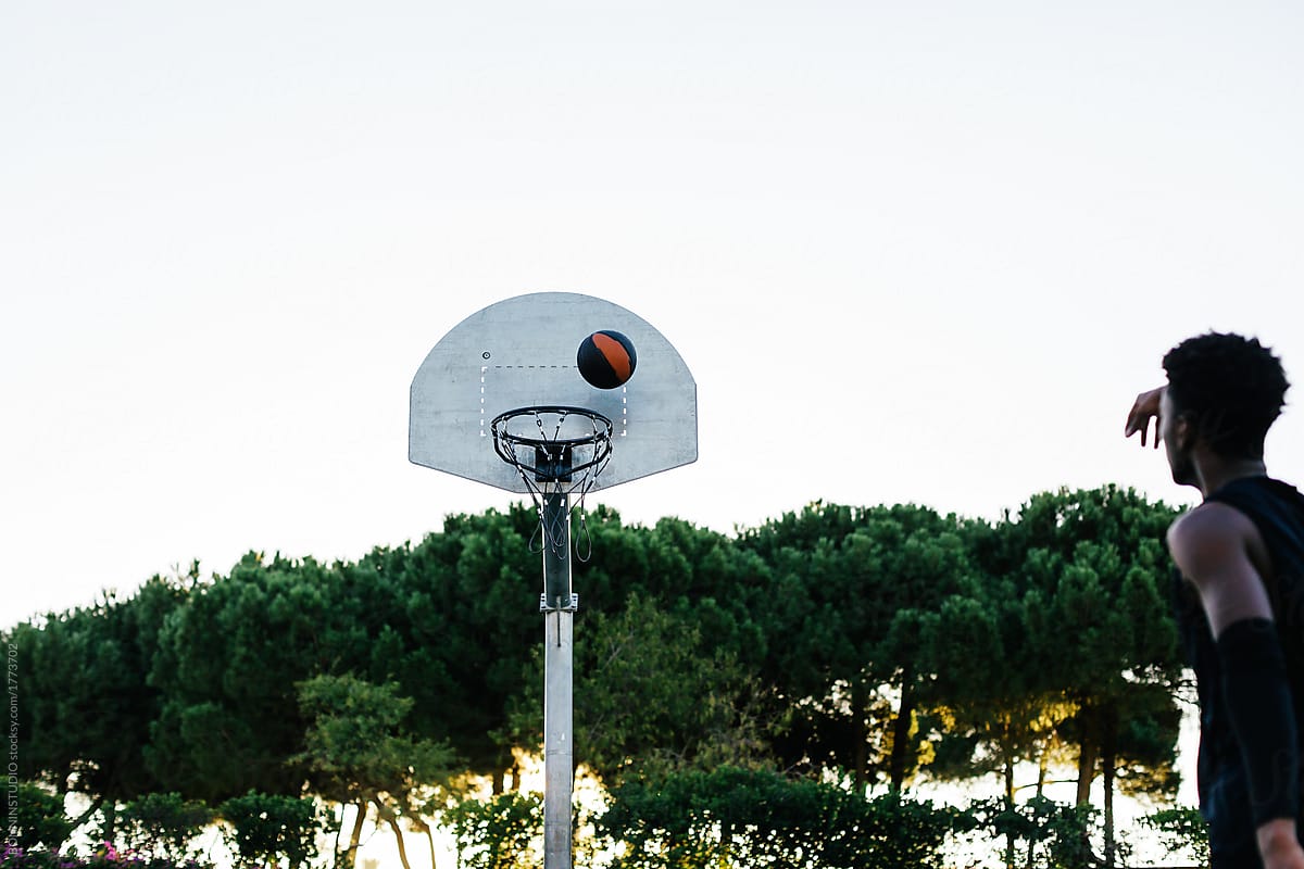 "Back View Of An African American Man Playing Basketball On Outdoor ...