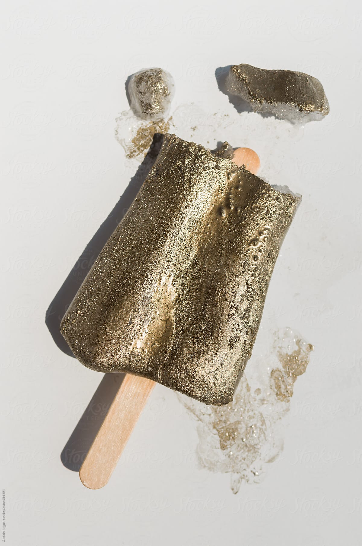 "Golden Ice Lolly" by Stocksy Contributor "Alessio Bogani" - Stocksy