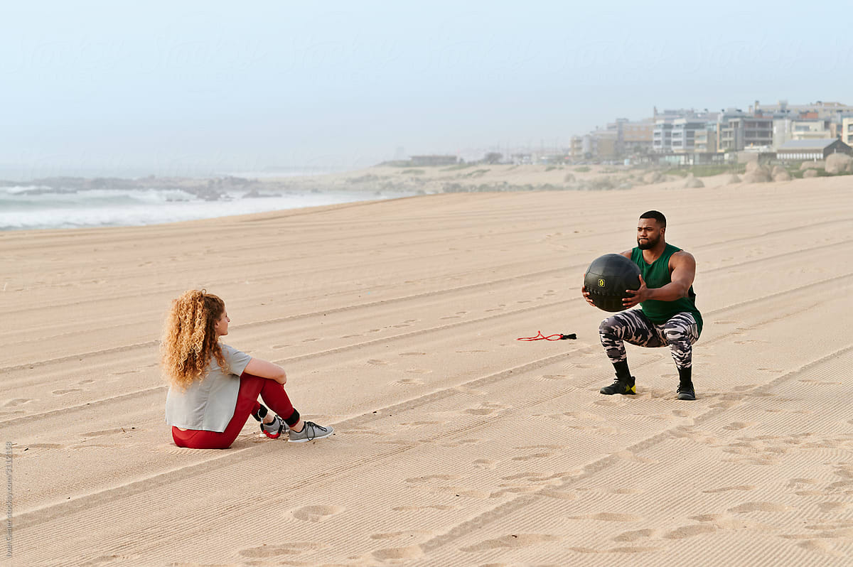 "Friends Working Out At The Beach" by Stocksy Contributor "Ivan Gener ...