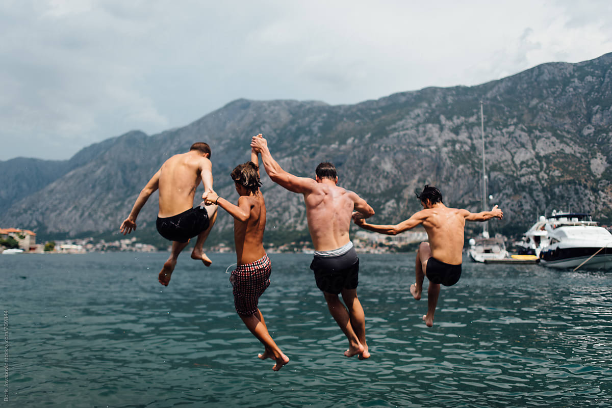 "Four Crazy Friends Jumping Into The Sea" by Stocksy Contributor "Boris ...