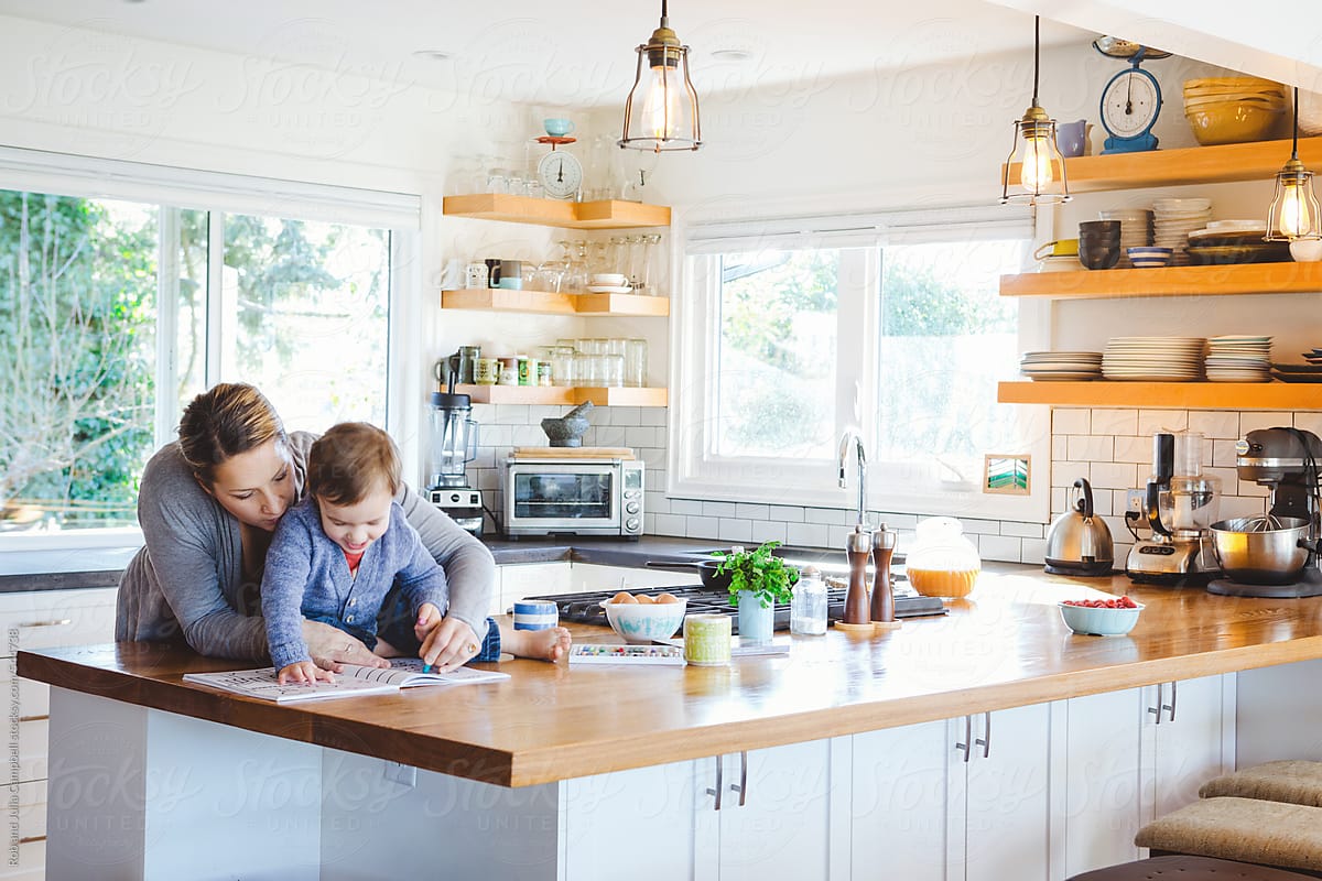 "Mom And Son Coloring Together In Bright, Modern Kitchen" by Stocksy ...