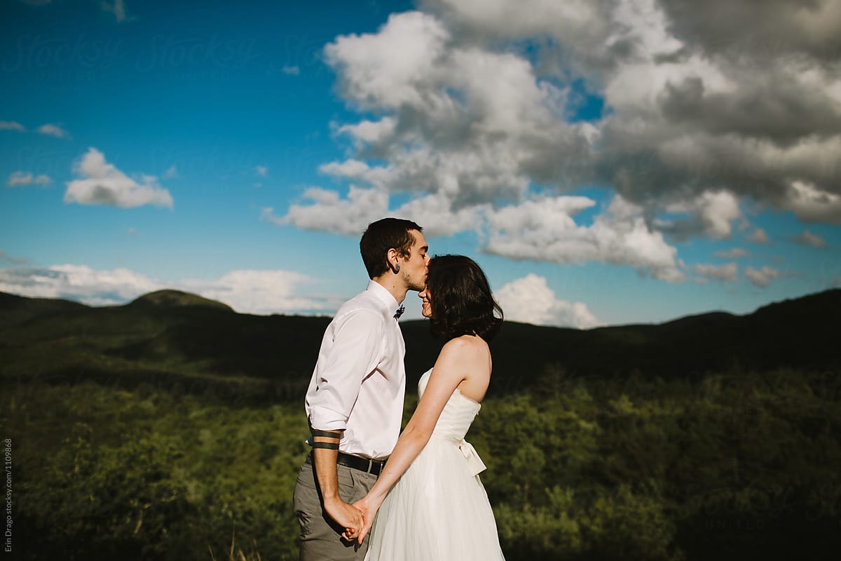 "Couple Kissing On Mountaintop" by Stocksy Contributor "Erin Drago ...