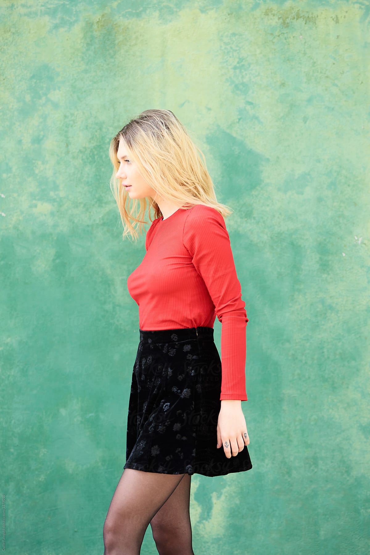 "Blonde Girl Over Green Wall." by Stocksy Contributor "Guille Faingold ...