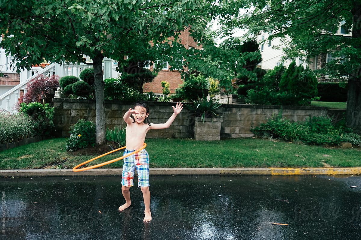 "Boy With Hula Hoop" by Stocksy Contributor "Kelli Seeger Kim" - Stocksy