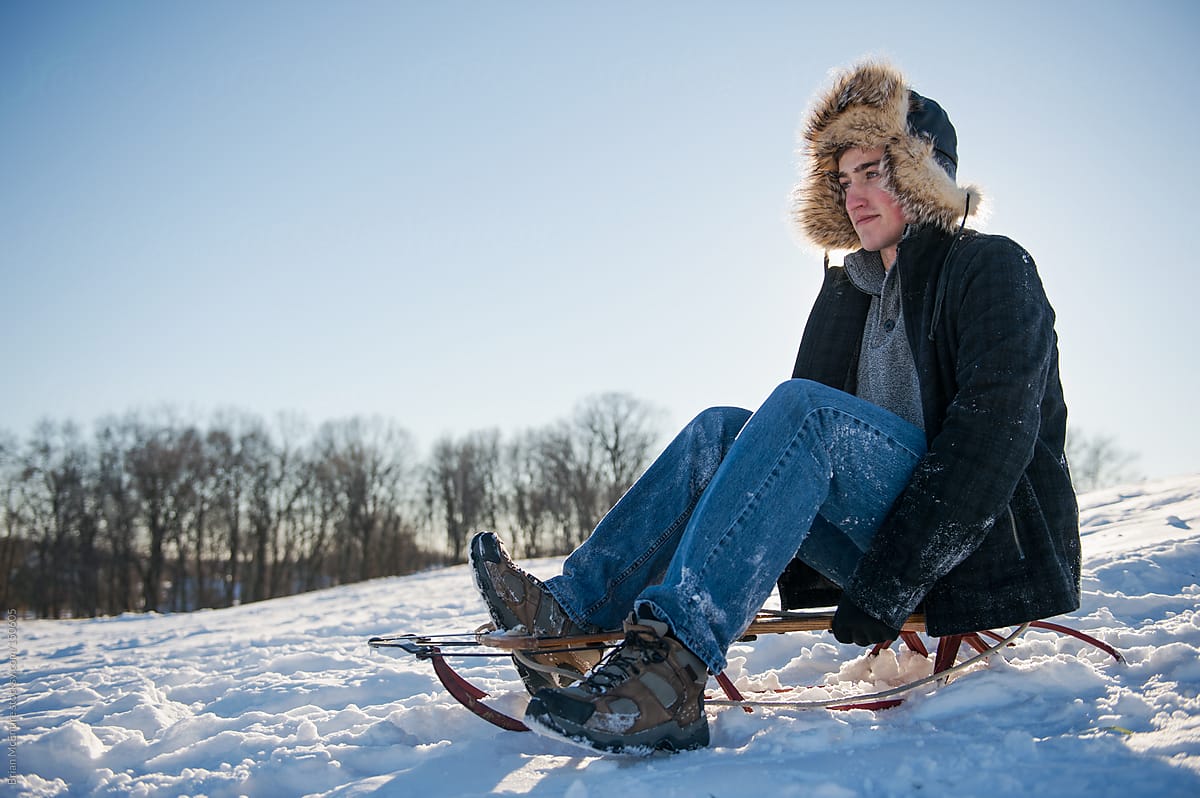"Man With Runner Sled On Sledding Hill" by Stocksy Contributor "Brian ...