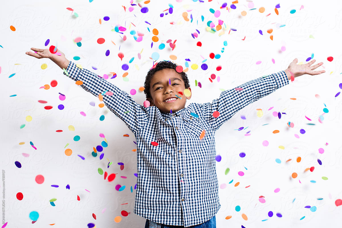 "Portrait Of A Little Boy Playing With Confetti Falls From Above." by ...