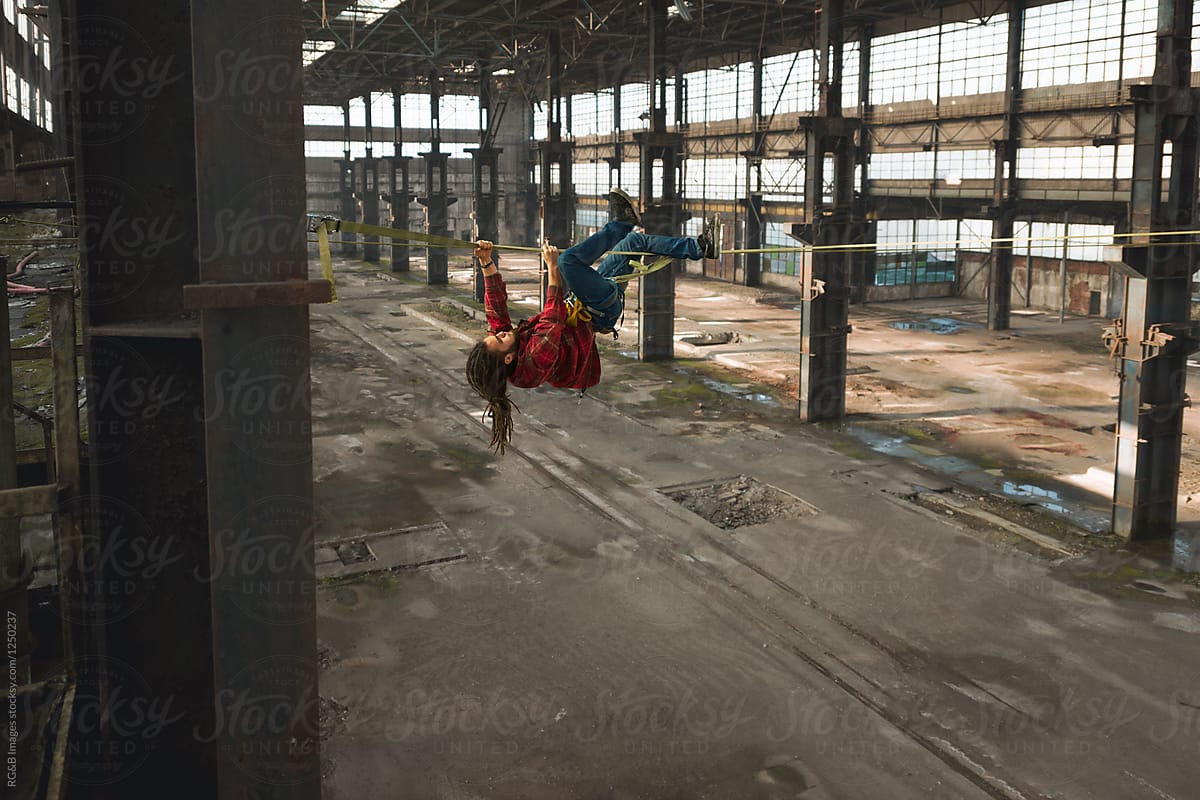 "Man Hanging On Highline In Abandoned Industrial Area" by Stocksy ...