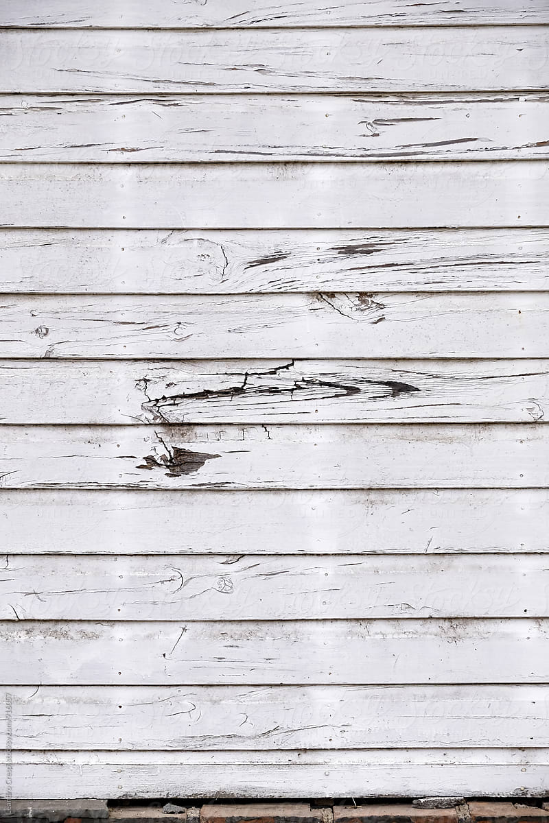 exterior-of-a-house-mural-composed-of-wooden-slats-white-de-stocksy