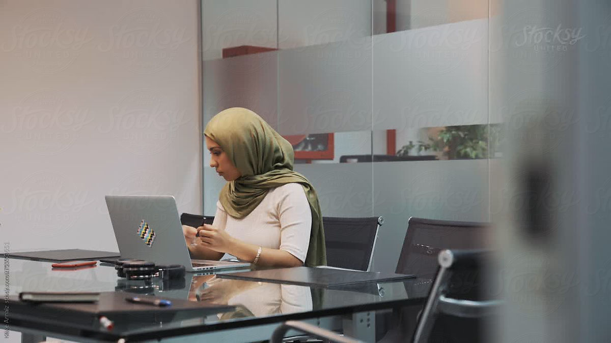 "Muslim Womanworking In An Office." by Stocksy Contributor "Kike Arnaiz ...