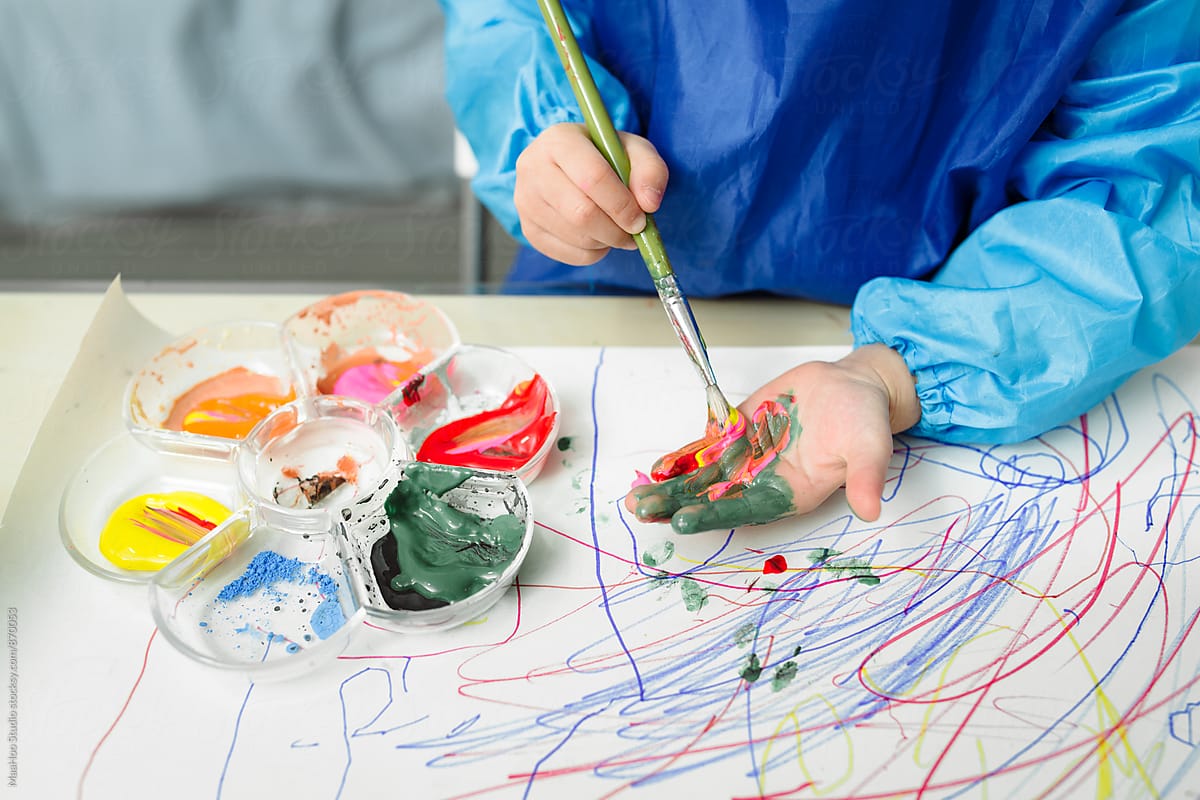 "Little Girl Painting On Hand" by Stocksy Contributor "MaaHoo" - Stocksy
