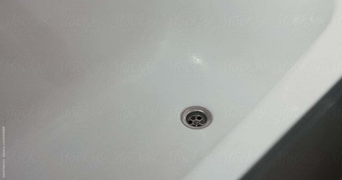 "Woman Putting Plug To Bath" by Stocksy Contributor "Danil Nevsky ...
