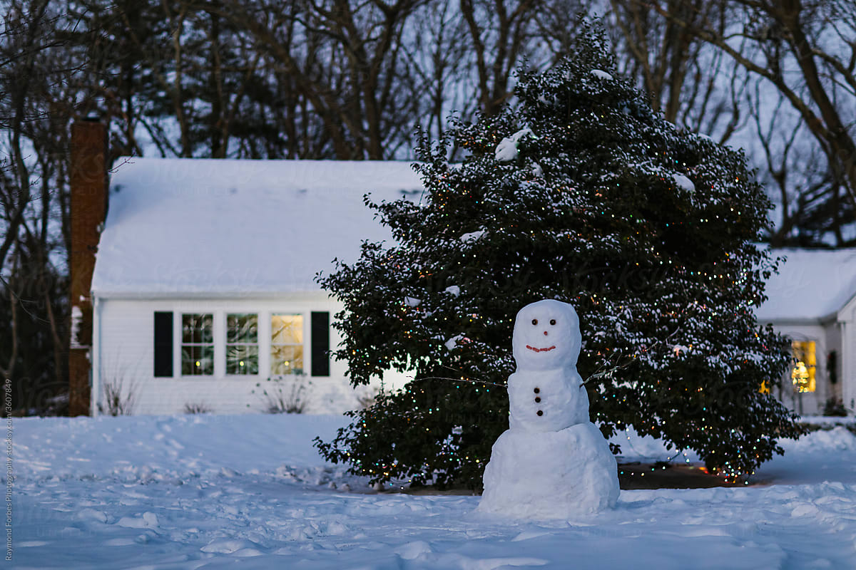 "Winter Landscape Snowman In Front Yard Of Warm Cozy Home" by Stocksy ...