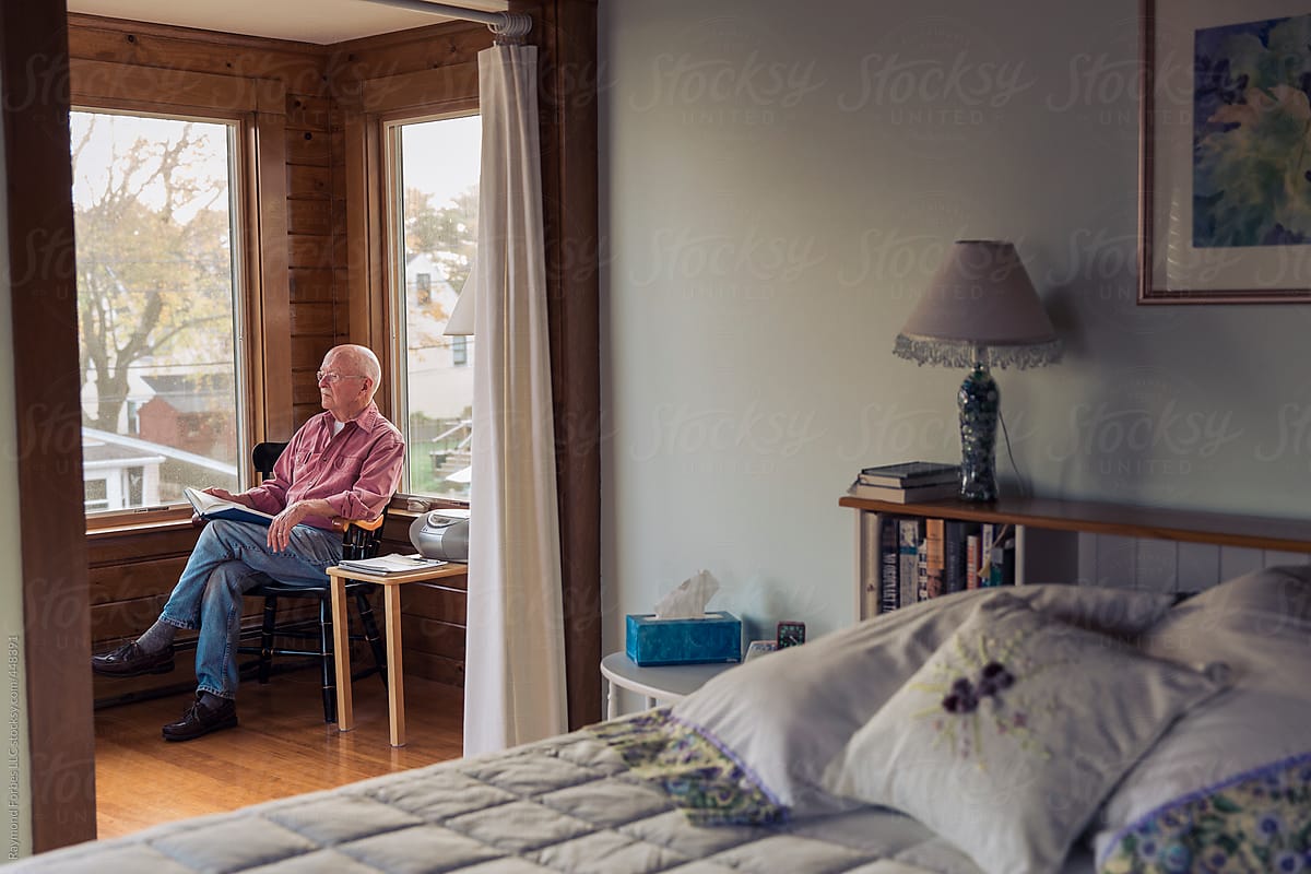 "Senior Citizen Man Reading Book At Home" by Stocksy Contributor ...