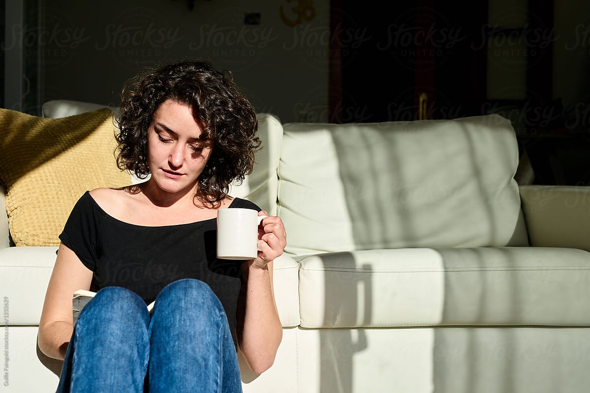 "Relaxing Woman With Cup Of Drink Reading Book" by Stocksy Contributor ...