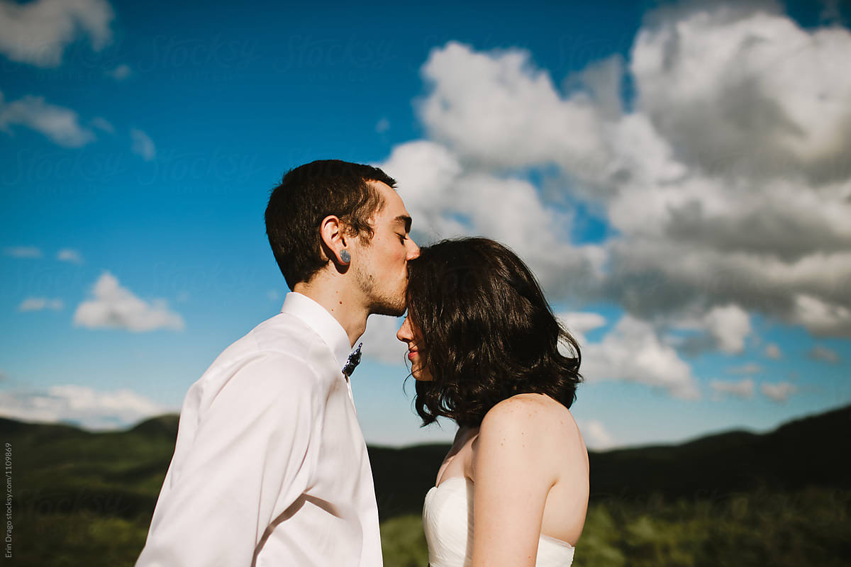 "Couple Kissing On Mountaintop" by Stocksy Contributor "Erin Drago ...