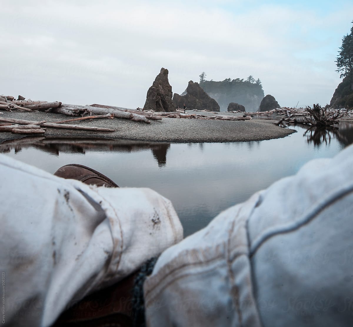 "Man Sitting At The Ocean Inlet" by Stocksy Contributor "Carey Haider ...