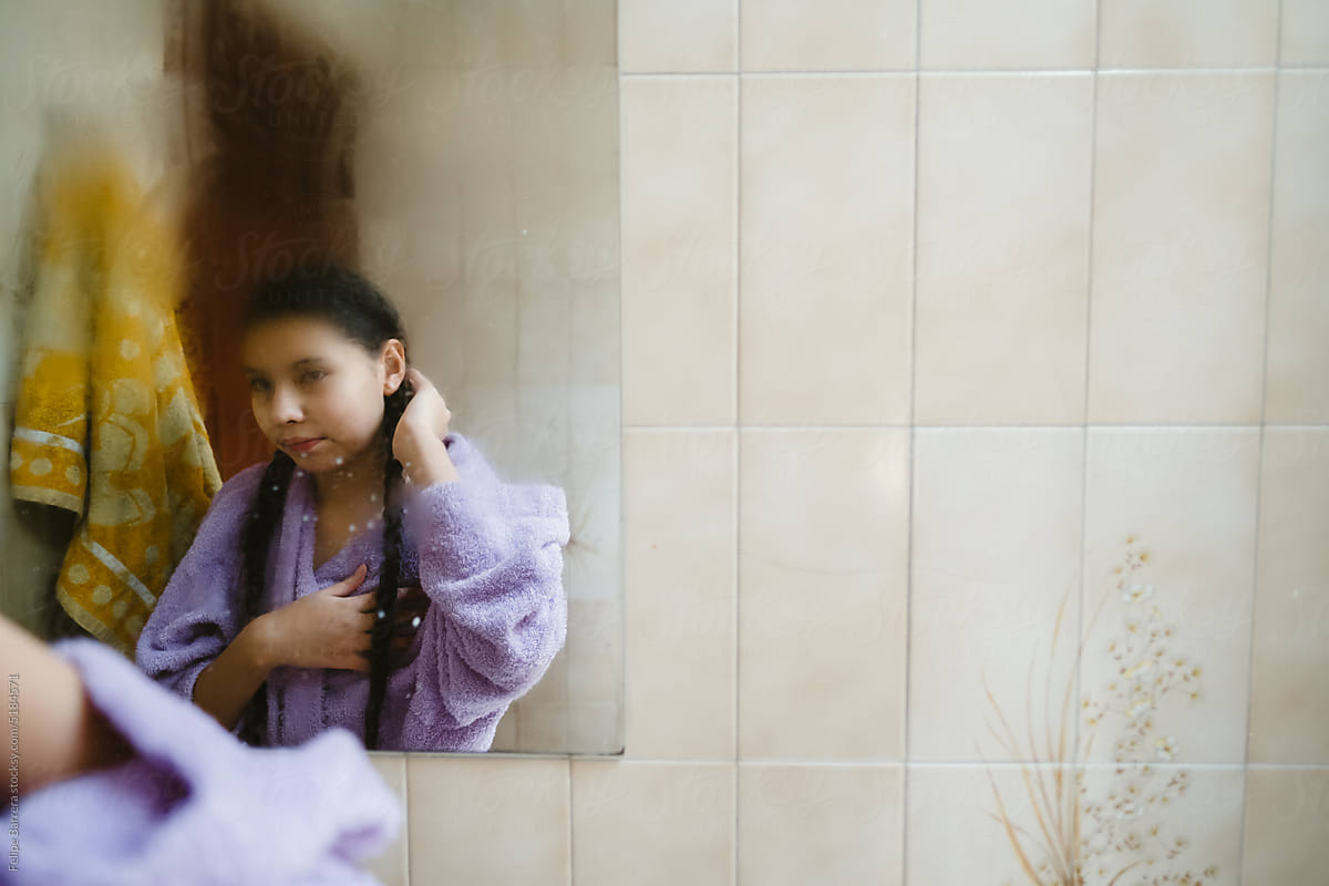 Fixing Hair In Mirror