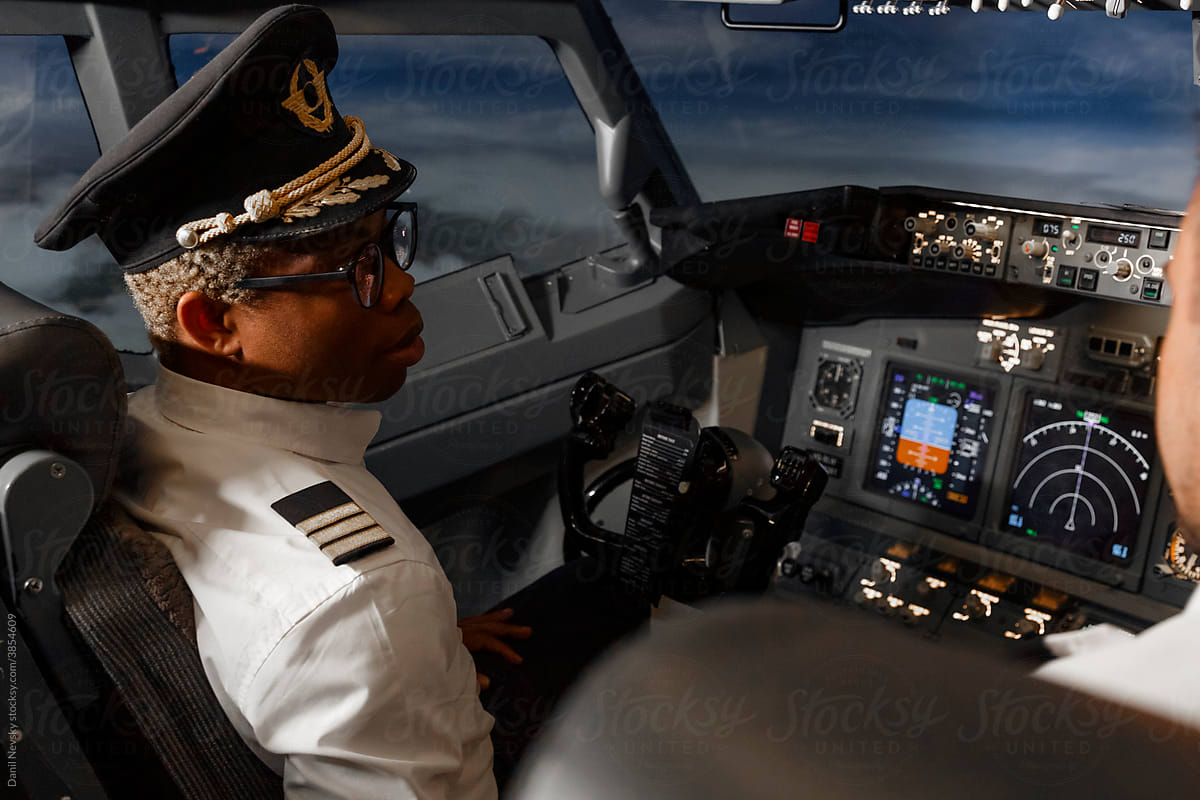 "Afro American Pilot Flying A Passenger Plane" by Stocksy Contributor ...