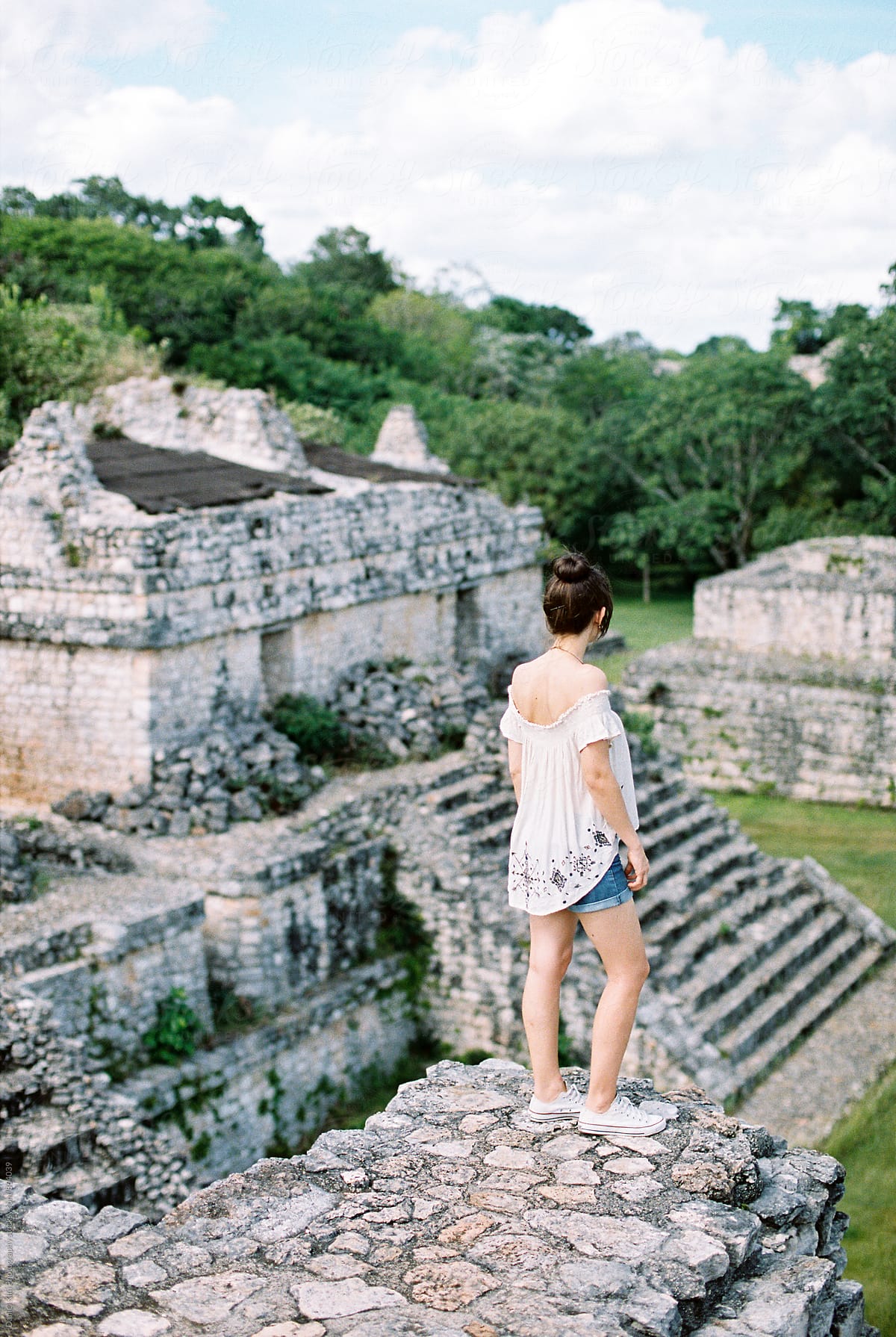 "Woman Standing Overlooking Ruins" by Stocksy Contributor "Daniel Kim ...