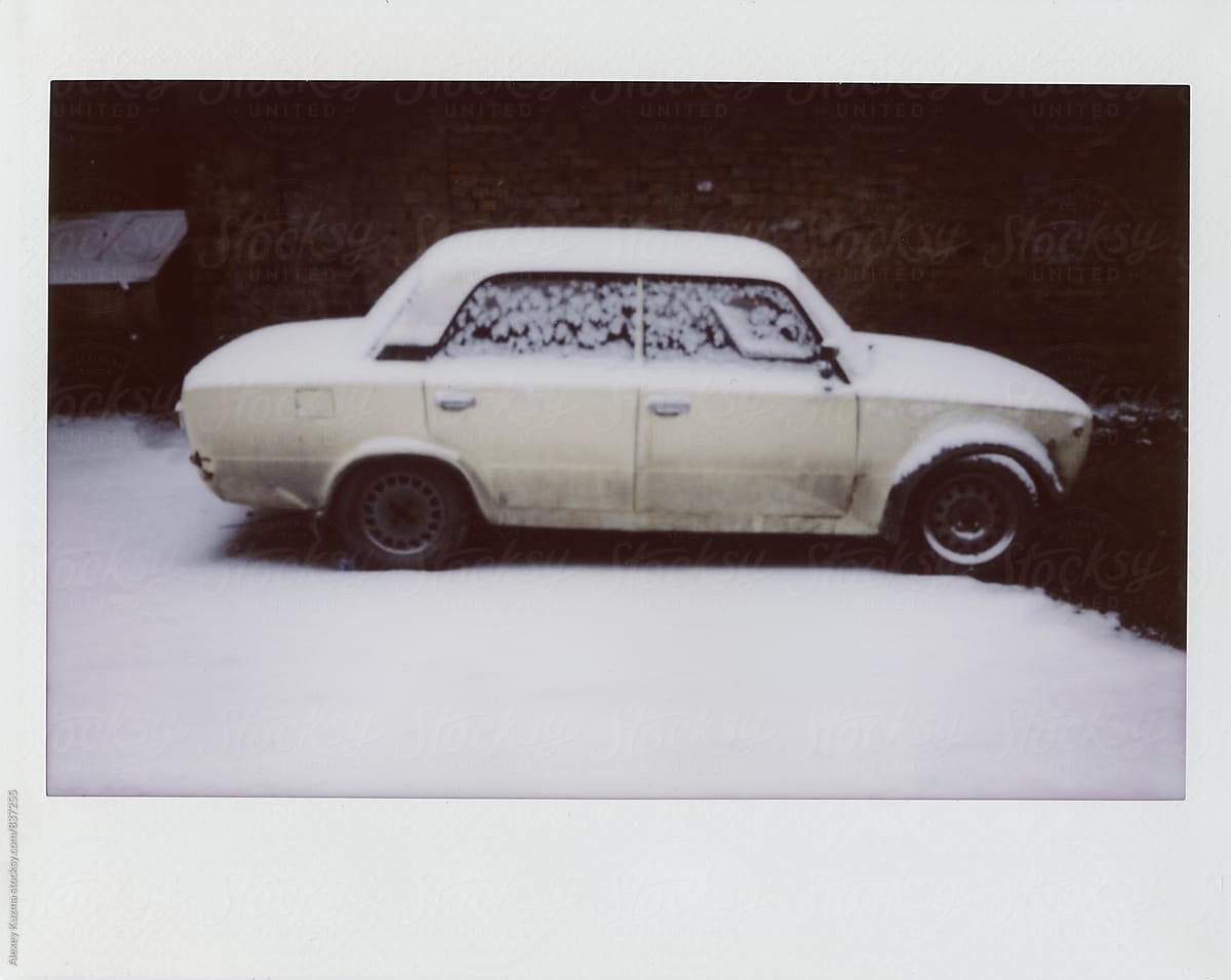 "Old Car Covered In Snow" by Stocksy Contributor "Alexey Kuzma" - Stocksy