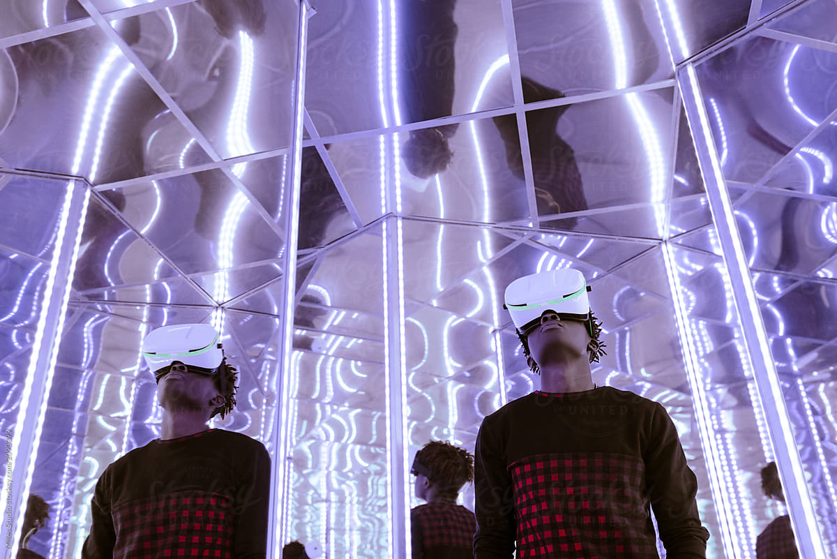 "Black Man In VR Goggles In Mirror Maze" by Stocksy Contributor "Milles ...