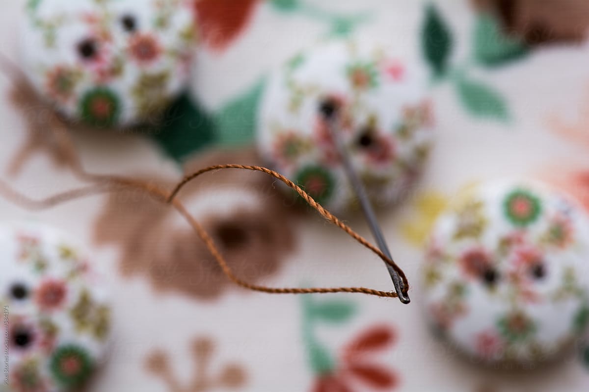 "Needle With Brown Thread Macro" by Stocksy Contributor "Sibila and ...