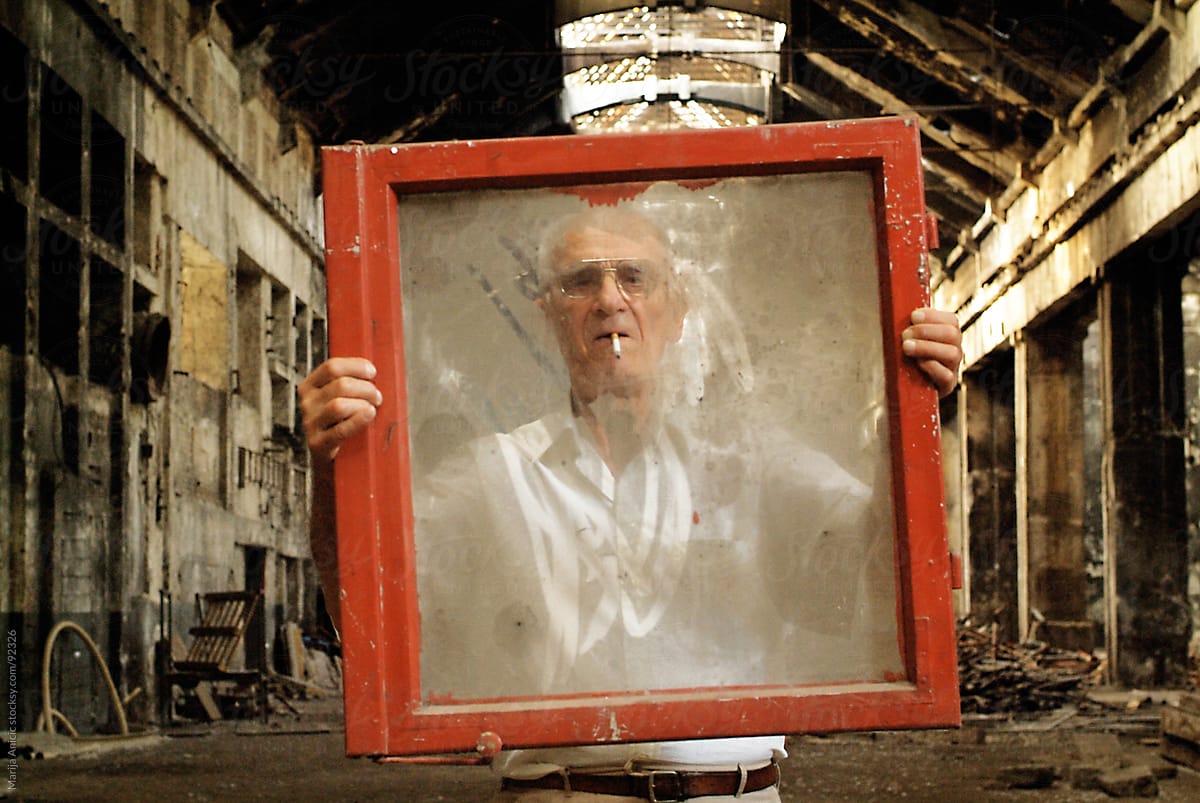 "Old Man Holding Red Frame In Rural Ambient" by Stocksy Contributor ...