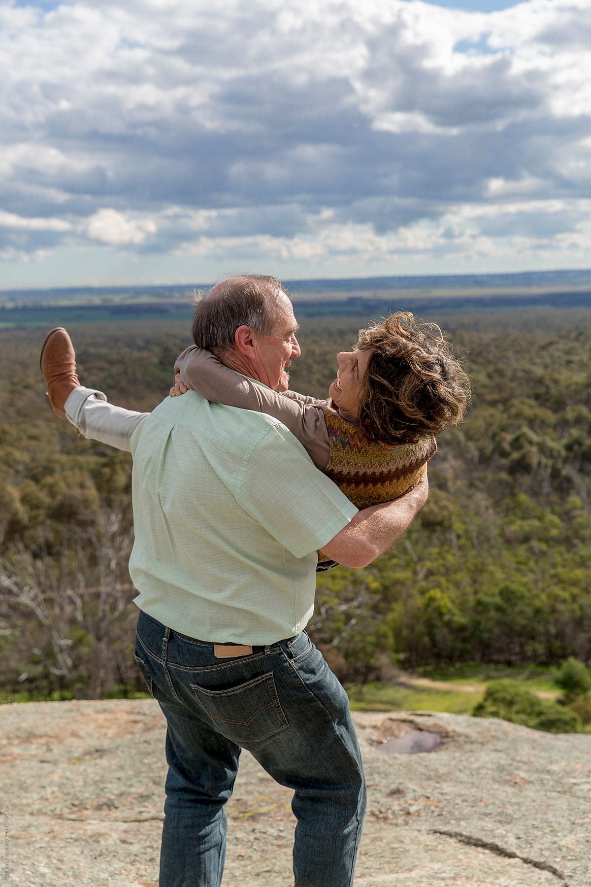 "Male Grey Nomad Carrying Female Partner Across Rocky Outcrop" by ...