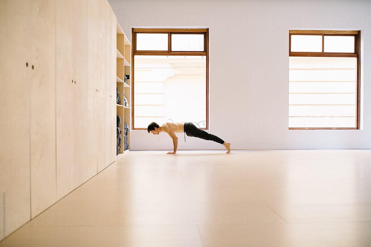 "Crop Yogi In Handstand" by Stocksy Contributor "Javier Díez" - Stocksy