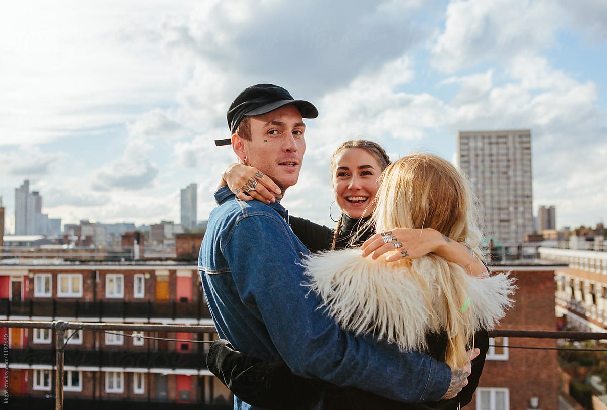 "Three Friends Hugging On A Rooftop" by Stocksy Contributor "Kkgas ...