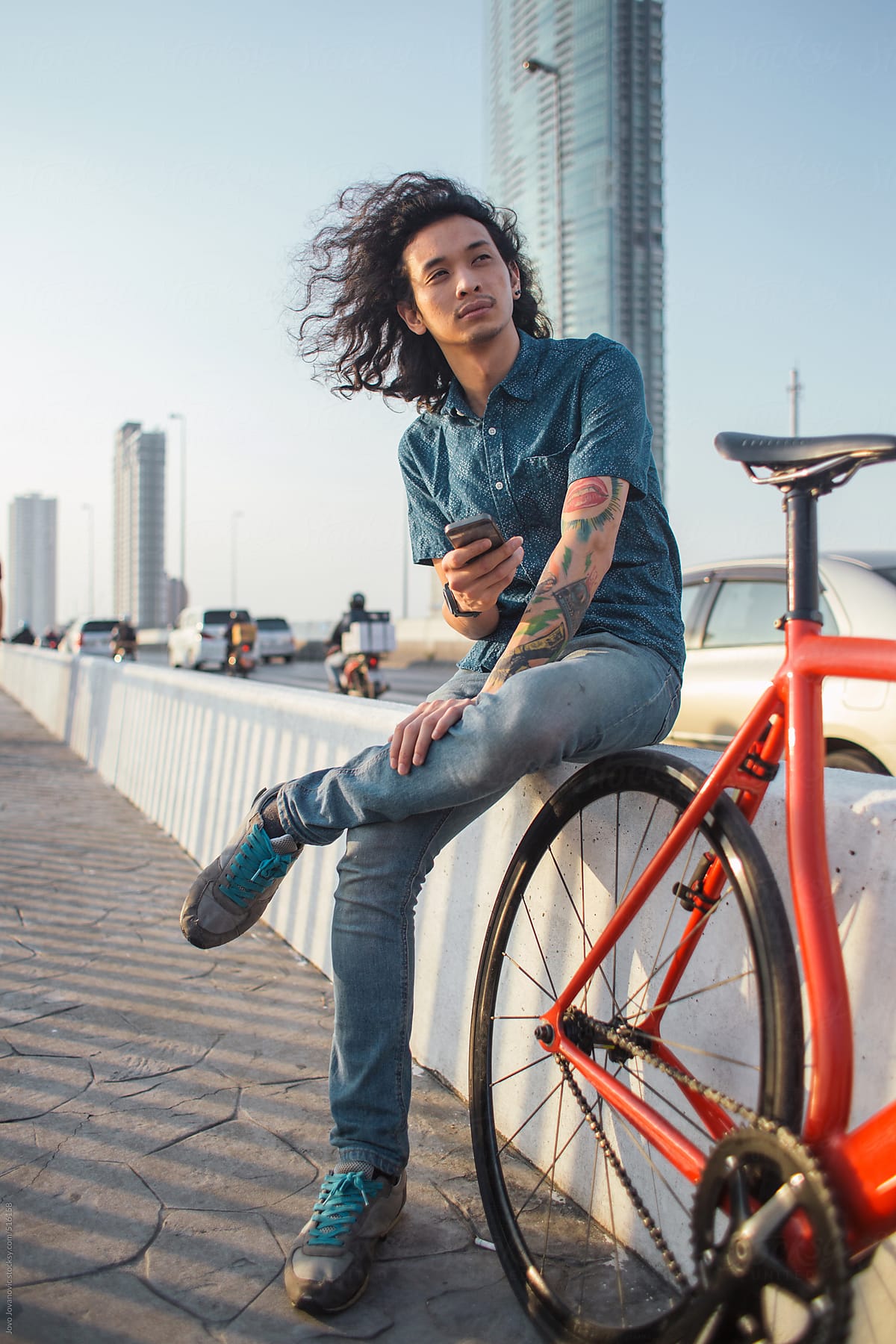 "Young Hip Asian Man Sitting Next To His Bicycle" by Stocksy ...