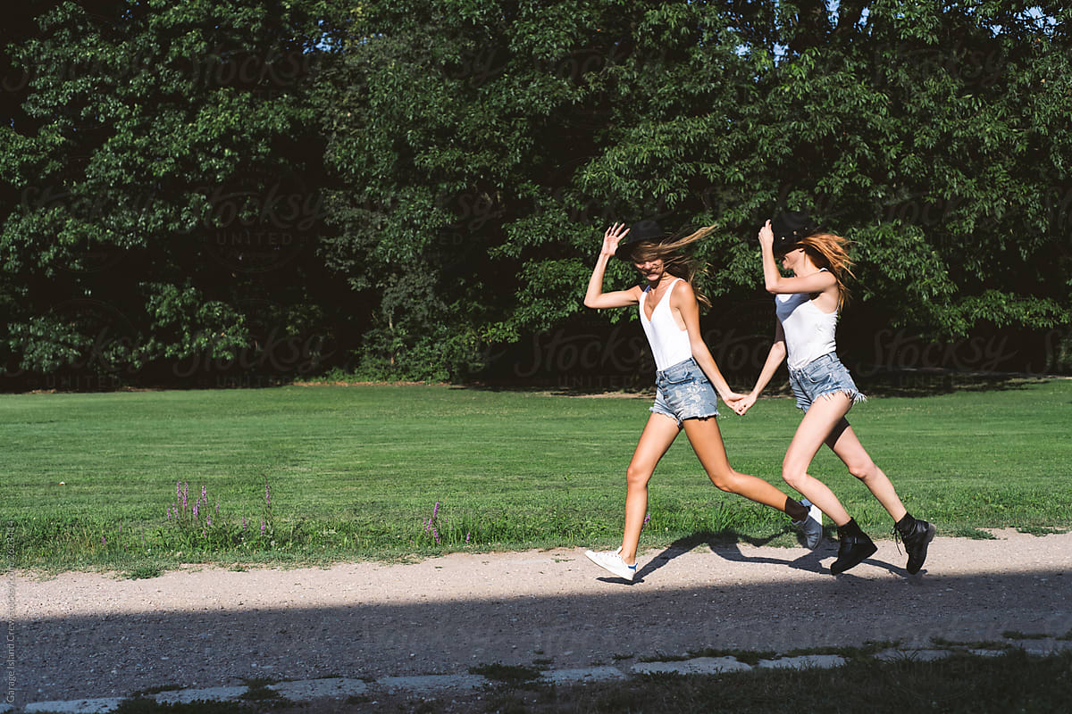 "Young Wild And Free Friends Running In The Nature" by Stocksy ...