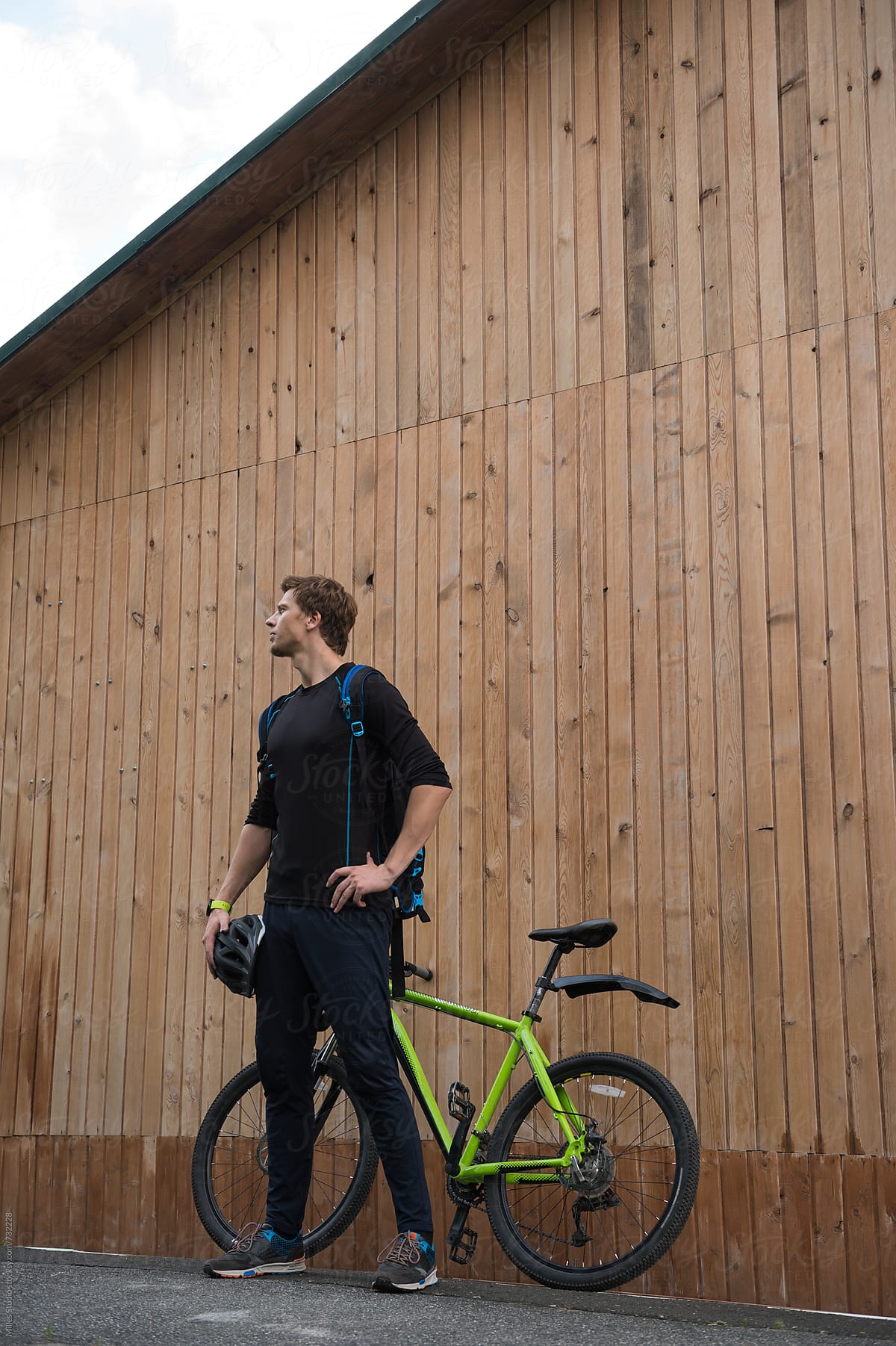 "Man Posing With His Bike" by Stocksy Contributor "Milles Studio" - Stocksy