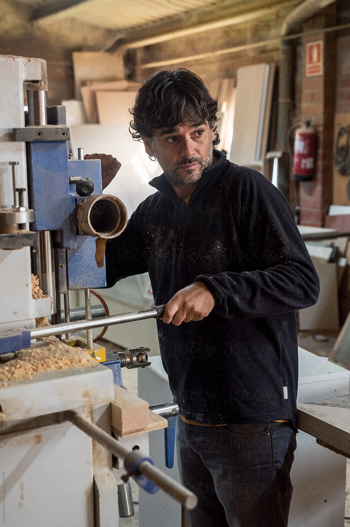 "Carpenter Polishing A Piece Of Wood" by Stocksy Contributor "Bisual ...