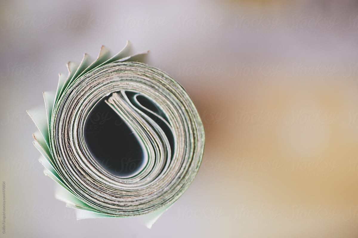 "Banknotes In Wad." by Stocksy Contributor "Guille Faingold" - Stocksy