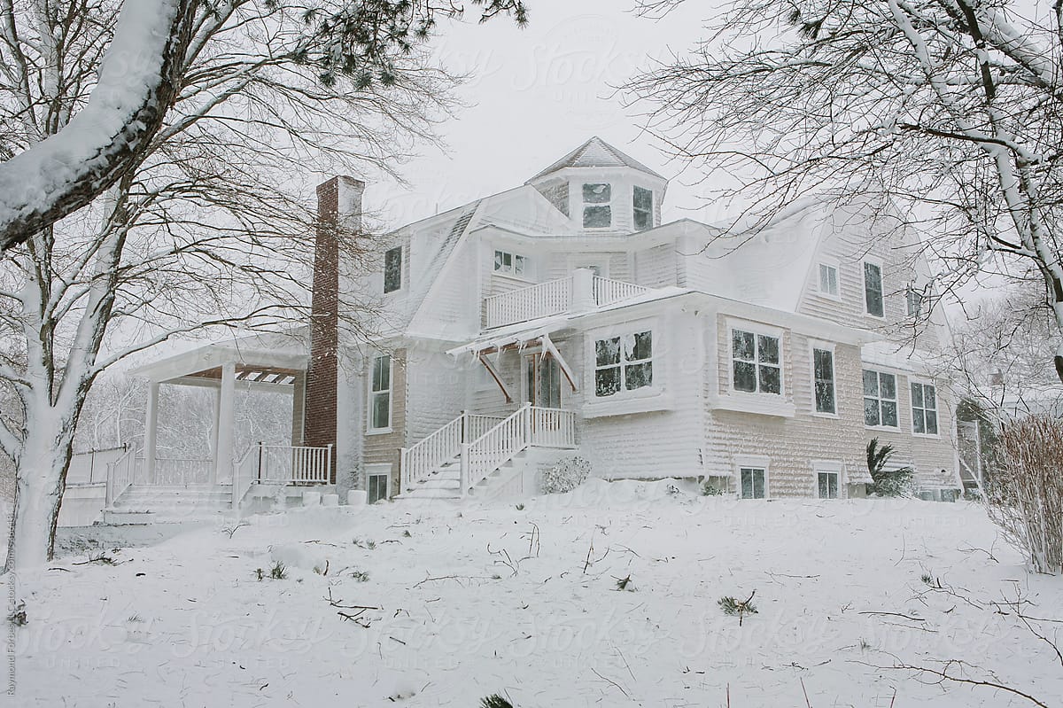 "House After Snow Blizzard" by Stocksy Contributor "Raymond Forbes LLC ...