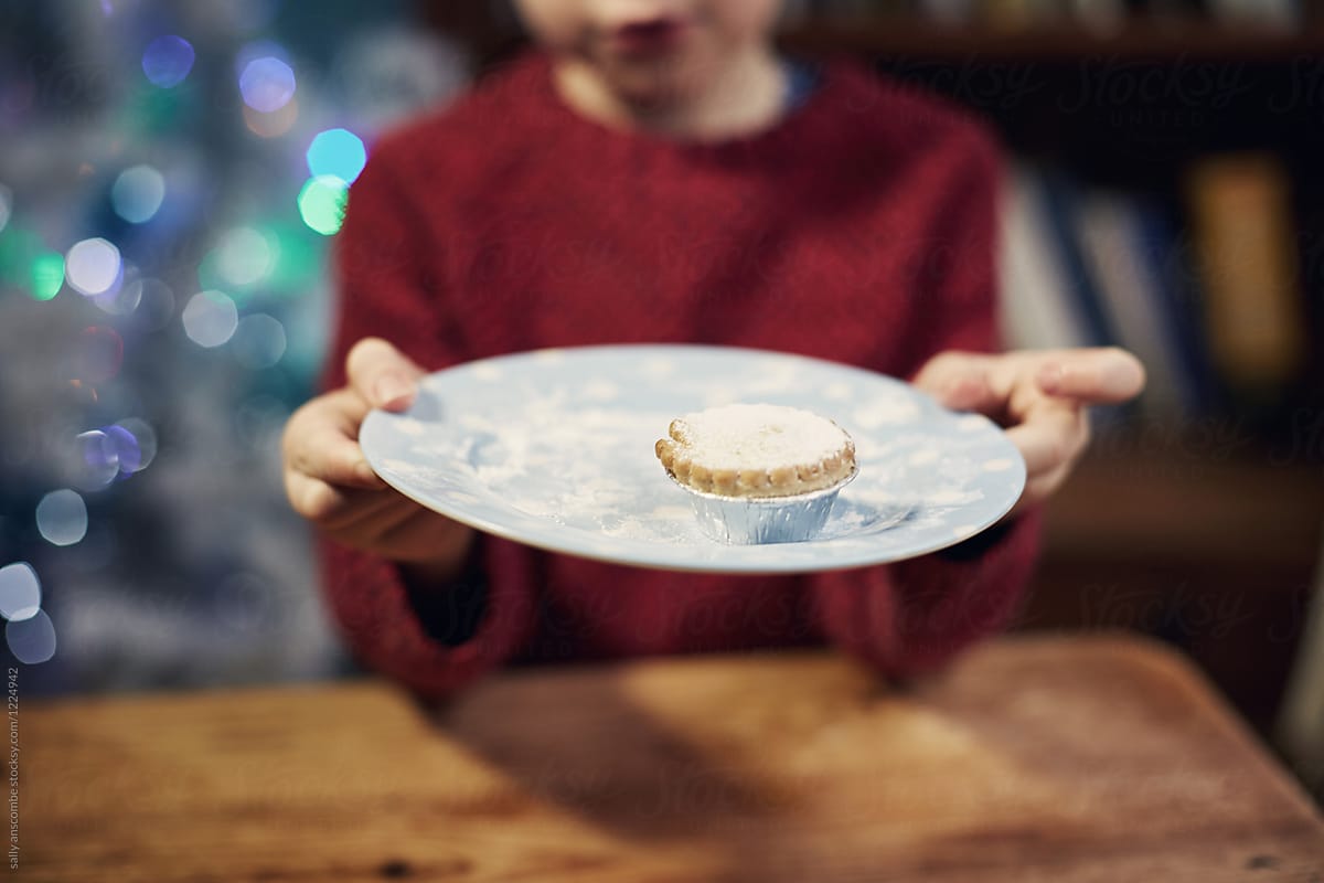 "Child Offering A Mince Pie On A Plate" by Stocksy Contributor "Sally ...