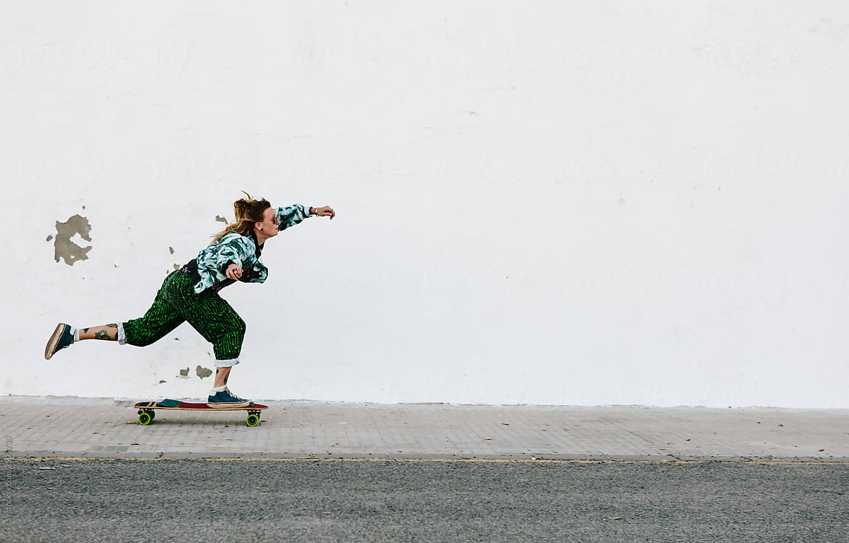 "Woman Skateboarding" by Stocksy Contributor "Kkgas" - Stocksy