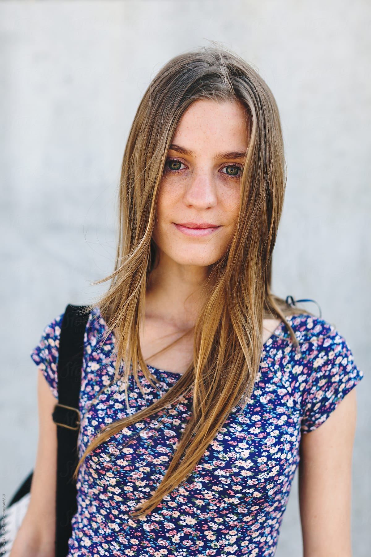 "Portrait Of A Young Freckled Woman Standing In Front Of A Wall." by ...