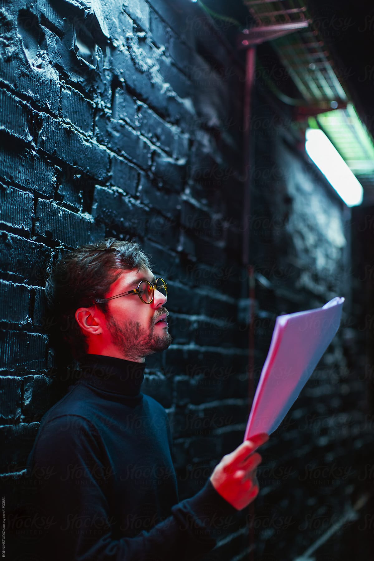 Actor Reviewing Script In Theatre By BONNINSTUDIO