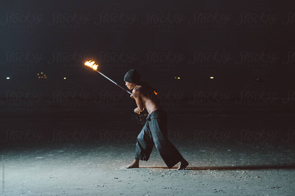 "Man Performing With Fire Stick" by Stocksy Contributor "B Krokodil ...